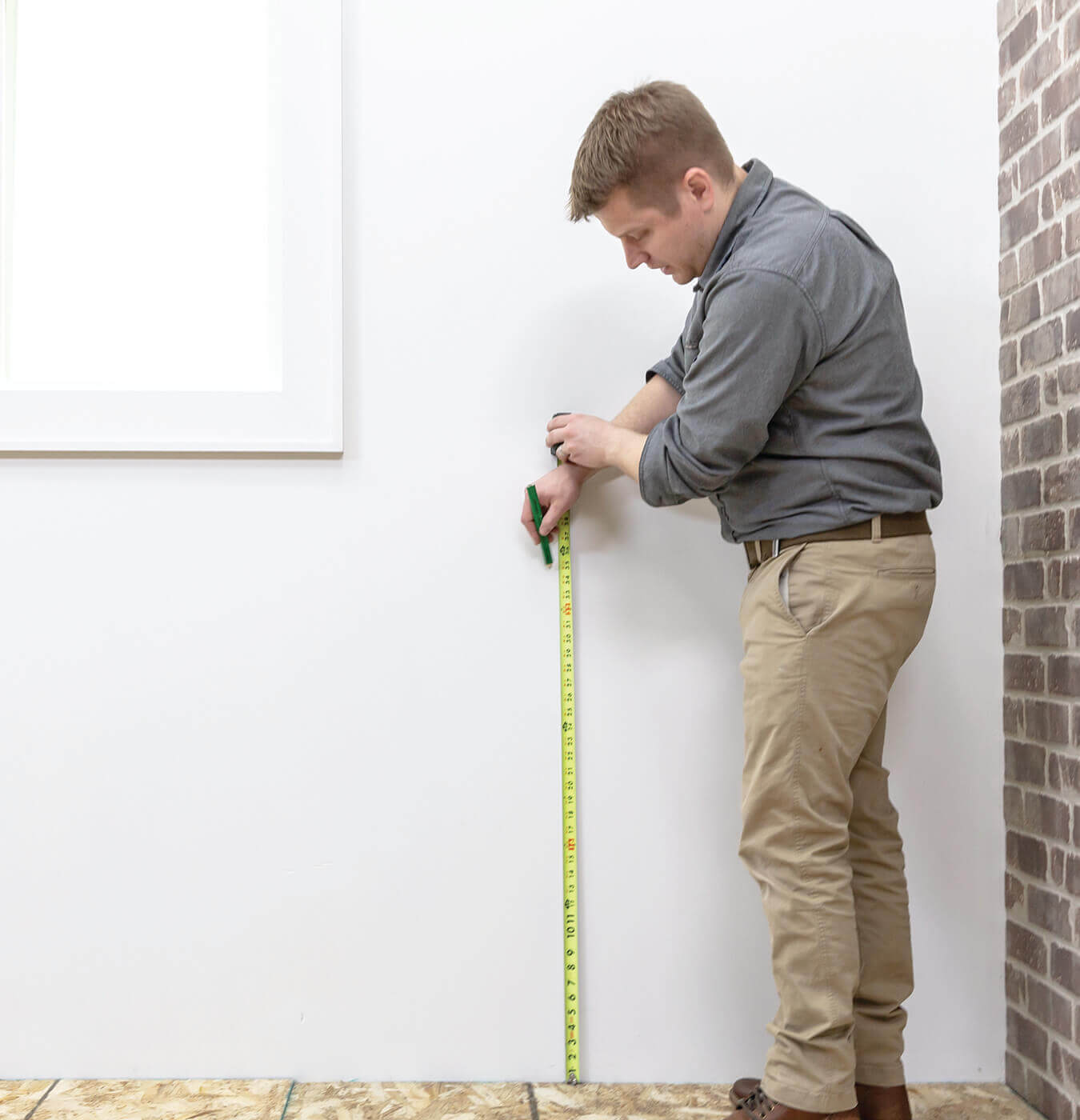 Measuring cabinet height on wall